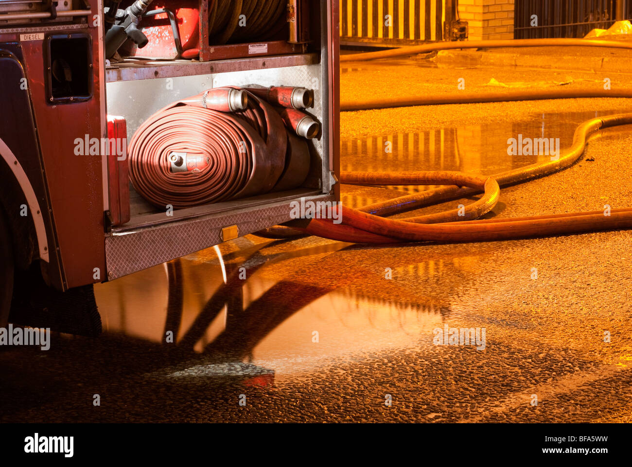 Fire engine hose locker at night Stock Photo - Alamy