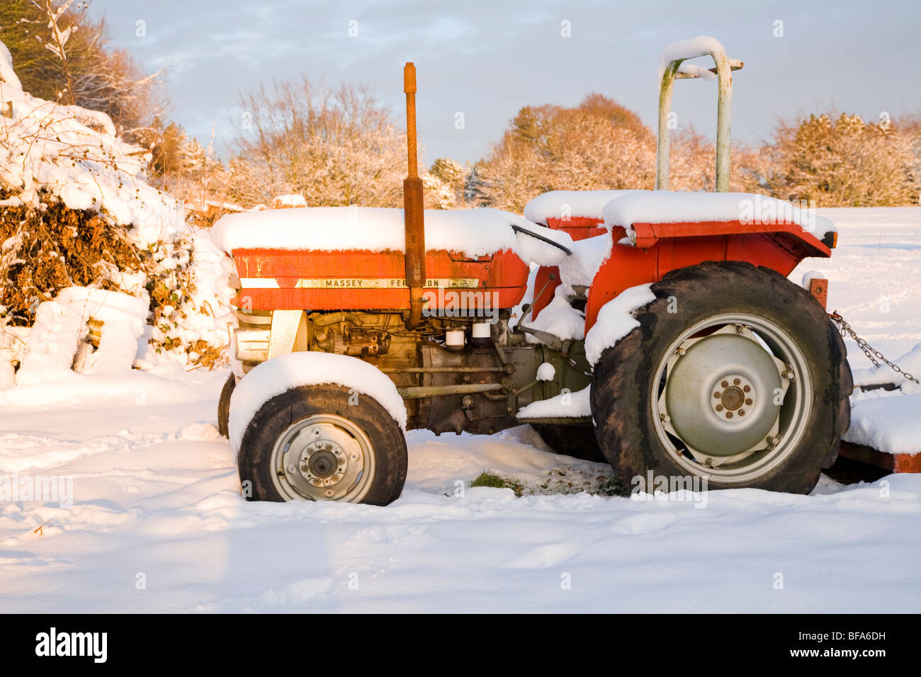 Snow scene, red tractor, winter, snow, farming Stock Photo - Alamy