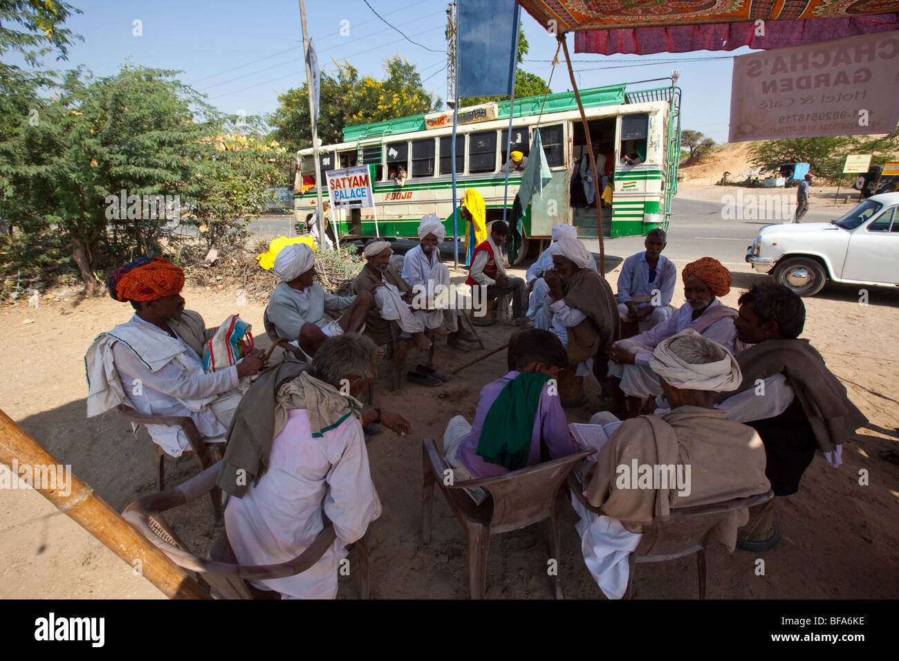 Rajput pilgrims sitting in front of their bus during the Camel Fair in ...