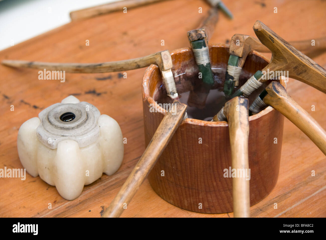 The tools for moko: Chisels dipped in water to clean off and a pigment ...