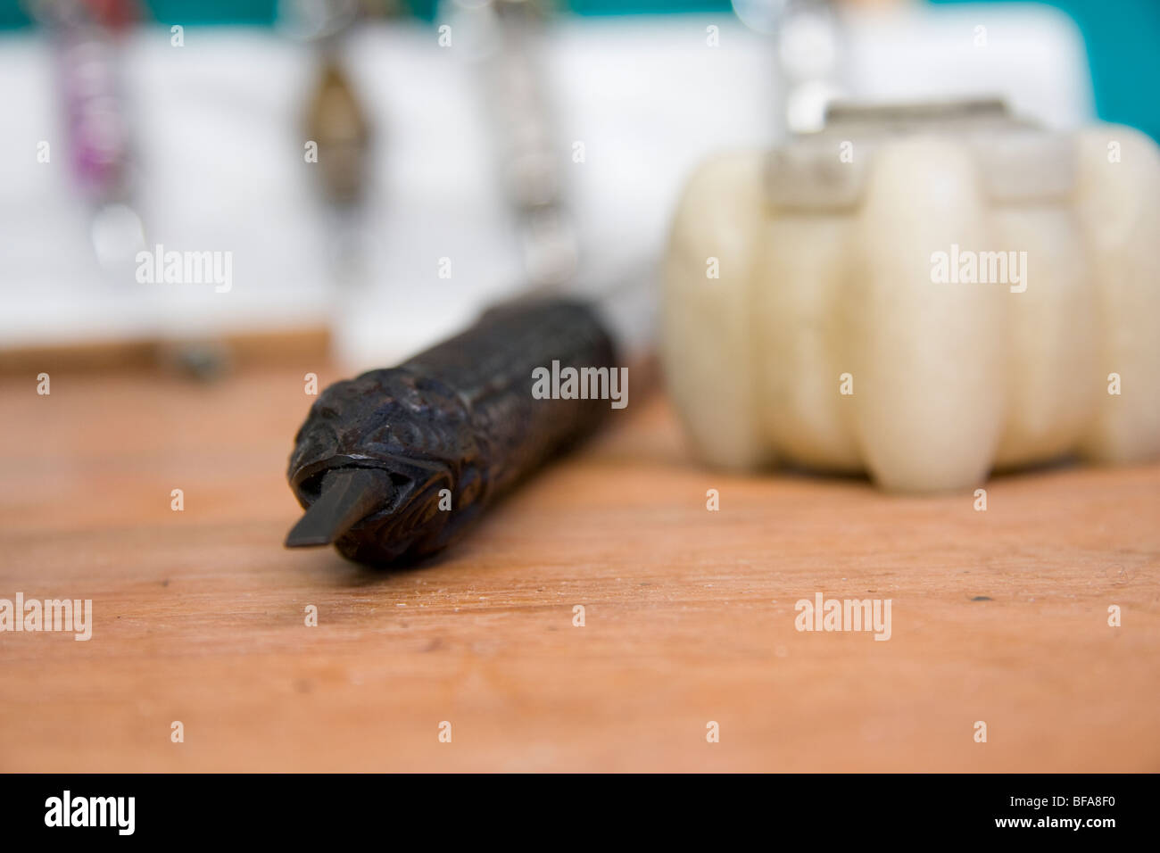 The tools for moko: View of a chisel and a pigment pot. Moko is Maori ...