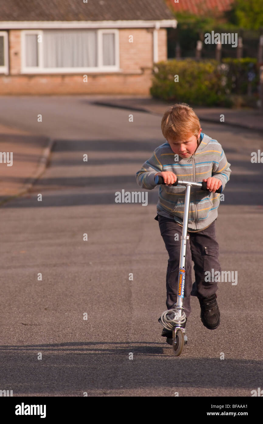 Children kids scooting uk hi-res stock photography and images - Alamy