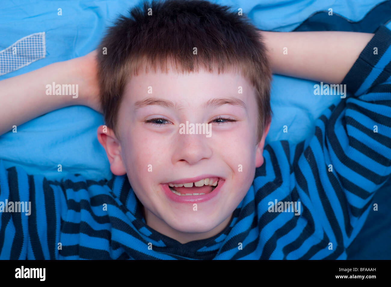 A Model Released Picture Of A Ten Year Old Boy Laughing In His Bedroom a-model-released-picture-of-a-ten-year-old-boy-laughing-in-his-bedroom