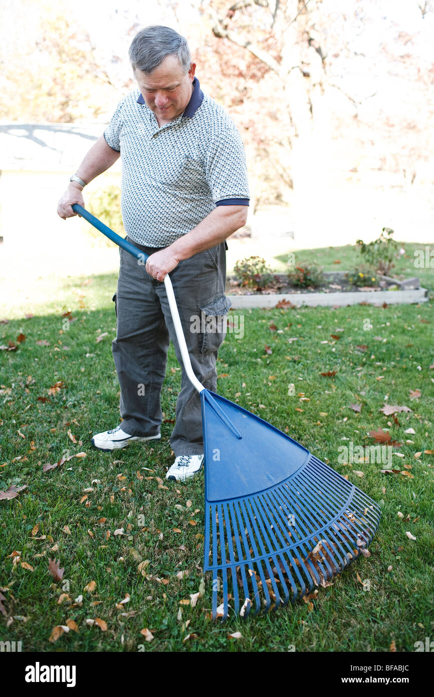 Man Raking Leaves Autumn Stock Photos & Man Raking Leaves Autumn Stock ...