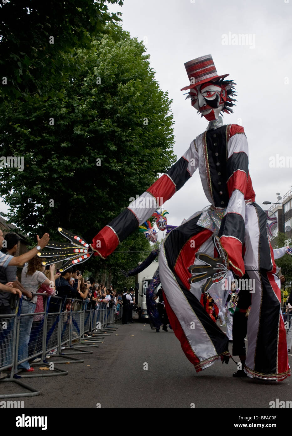 A tall man costume from the Sunshine International Arts float at the ...
