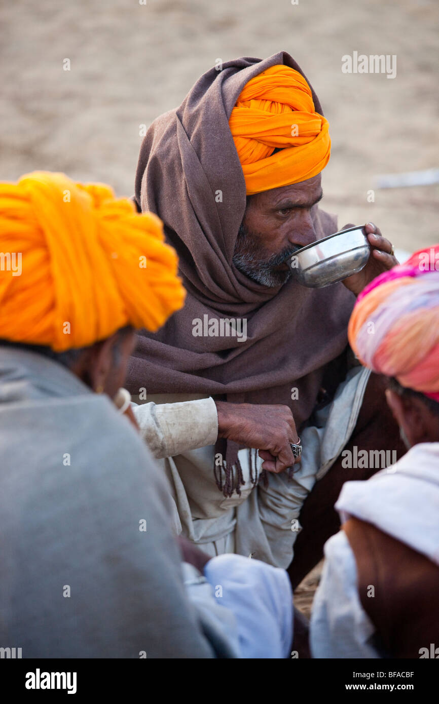 Rajput man drinking chai at the Camel Fair in Pushkar India Stock Photo ...