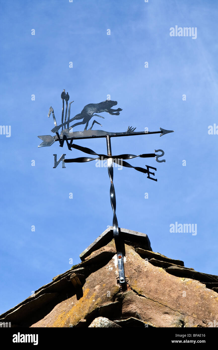 A weather vane on a roof Stock Photo - Alamy