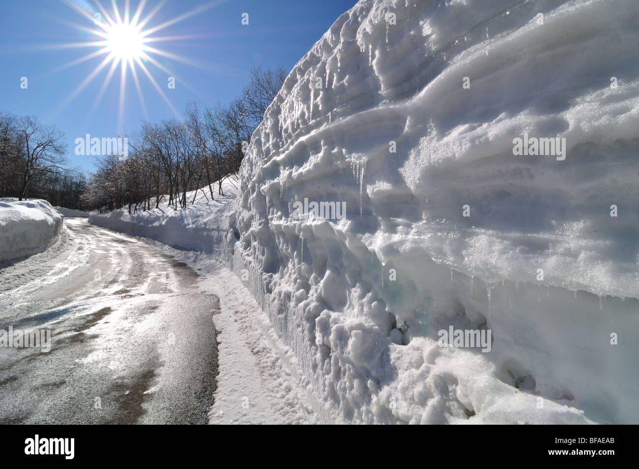 mountain road with driven snow-drift wall after snowplough action Stock ...