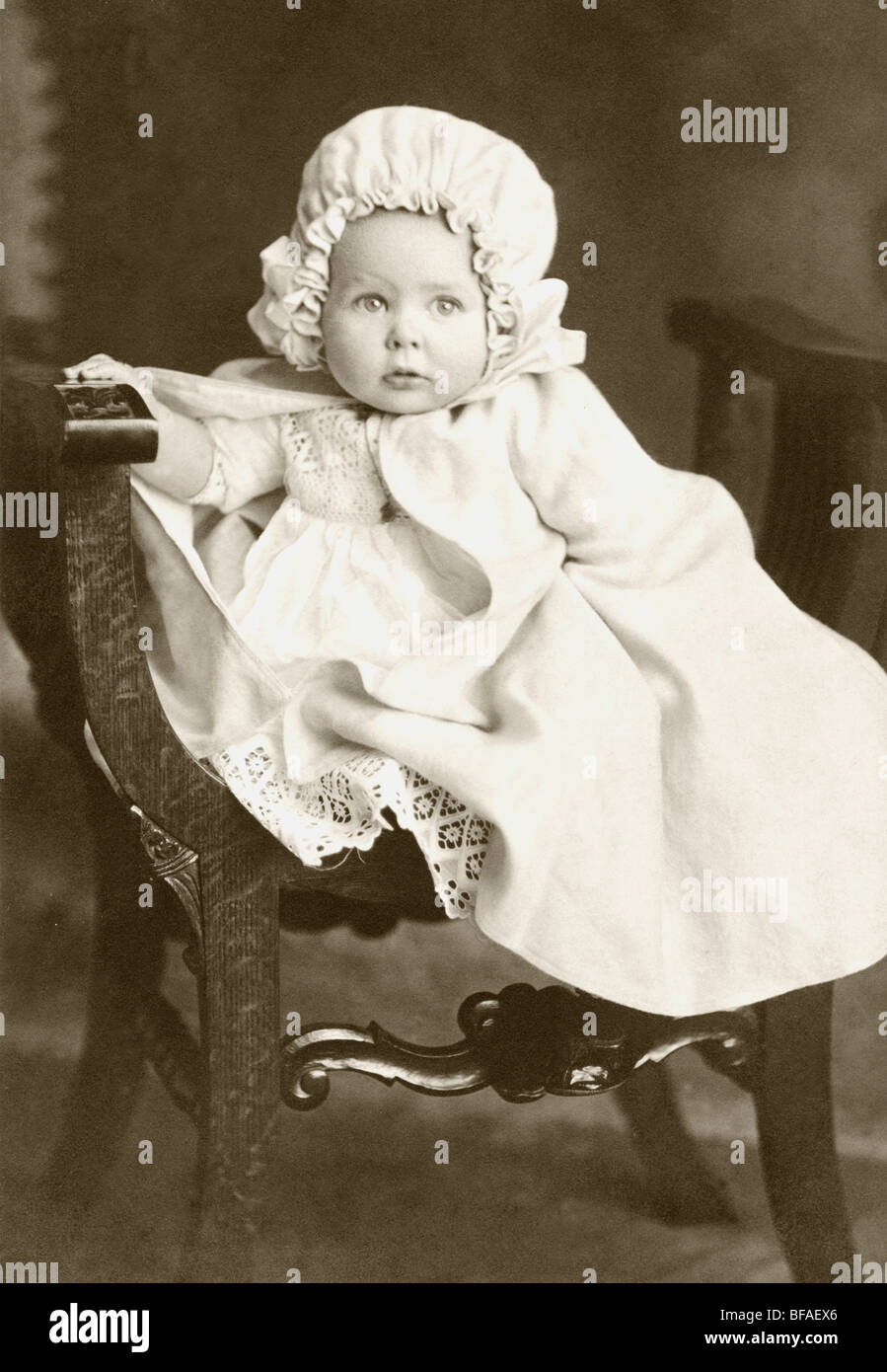 Adorable Infant with Round Face Wearing Bonnet Stock Photo - Alamy