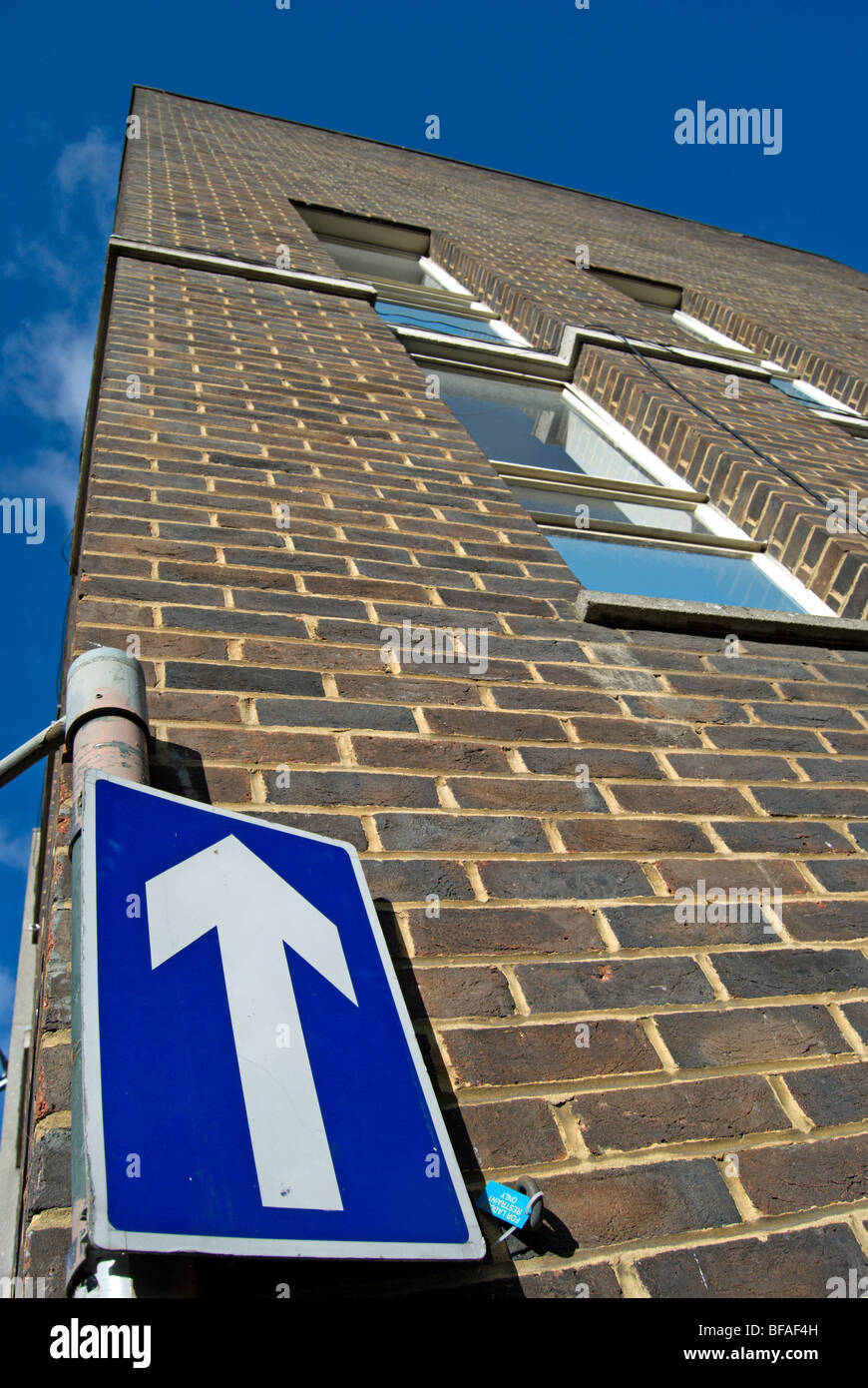 british traffic sign for a one-way street appearing to point directly ...
