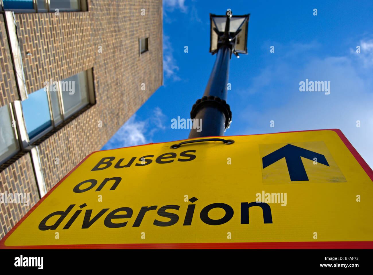 buses on diversion road sign fixed to a victorian style lamppost in ...