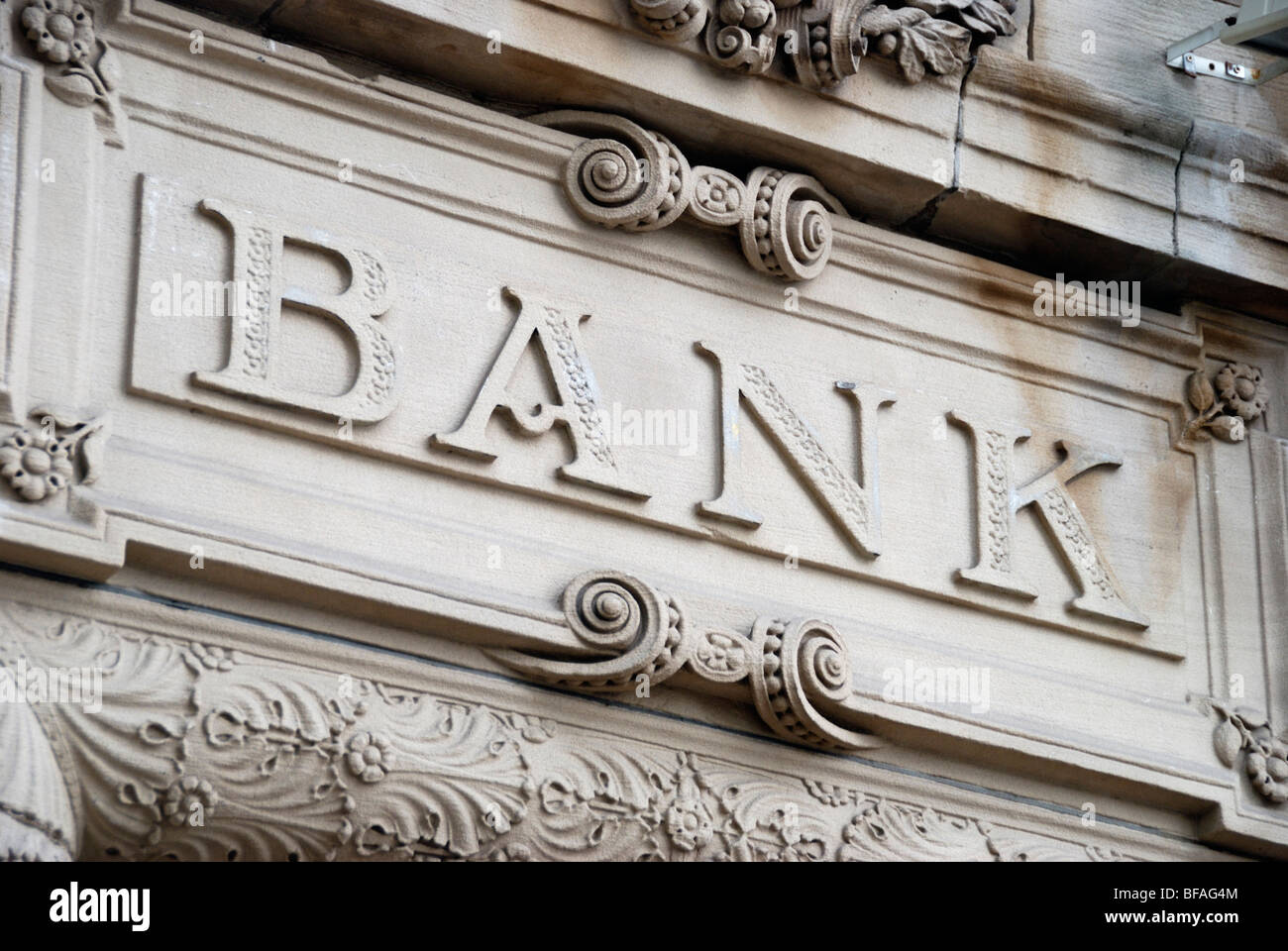 Old carved stone ' Bank ' sign on exterior of building Stock Photo - Alamy