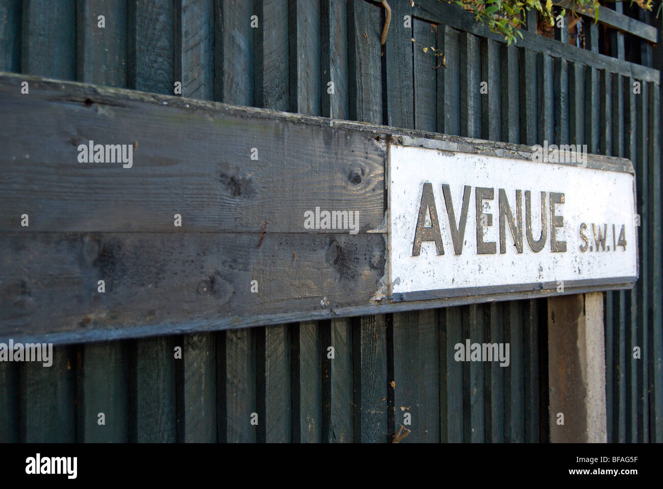 street name sign with name missing, only the word avenue remaining with ...