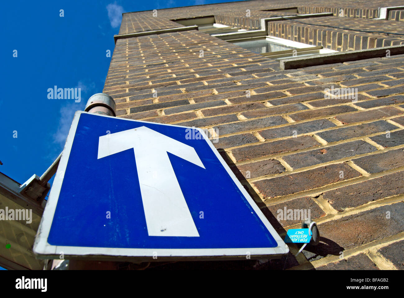british traffic sign for a one-way street appearing to point directly ...