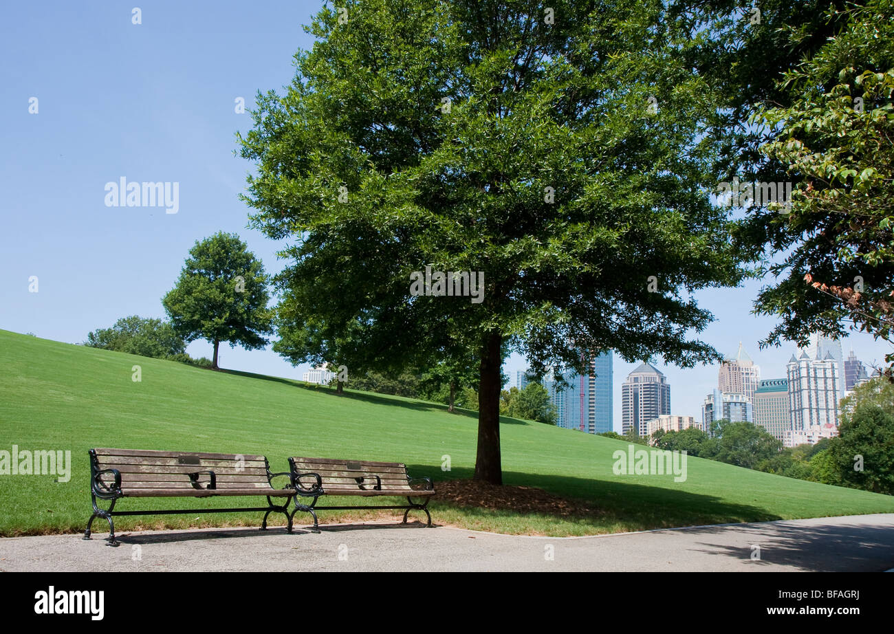 Two empty benches along a path in a public park Stock Photo - Alamy
