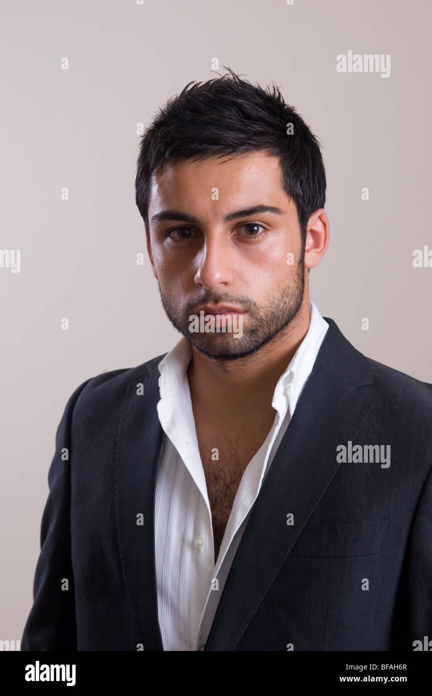 Serious young ethnic man Stock Photo - Alamy