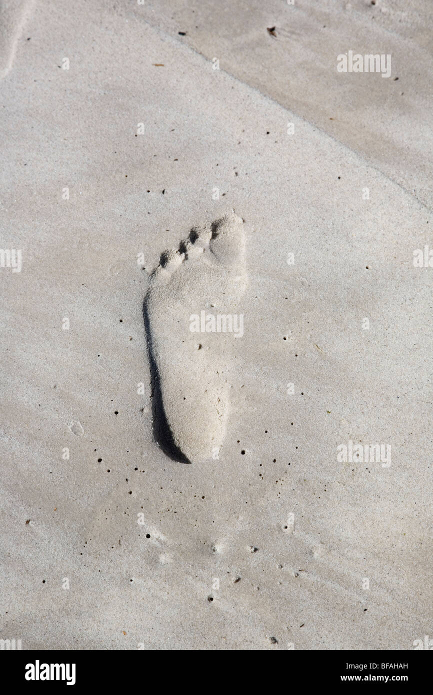 Footprint left in sand Stock Photo - Alamy