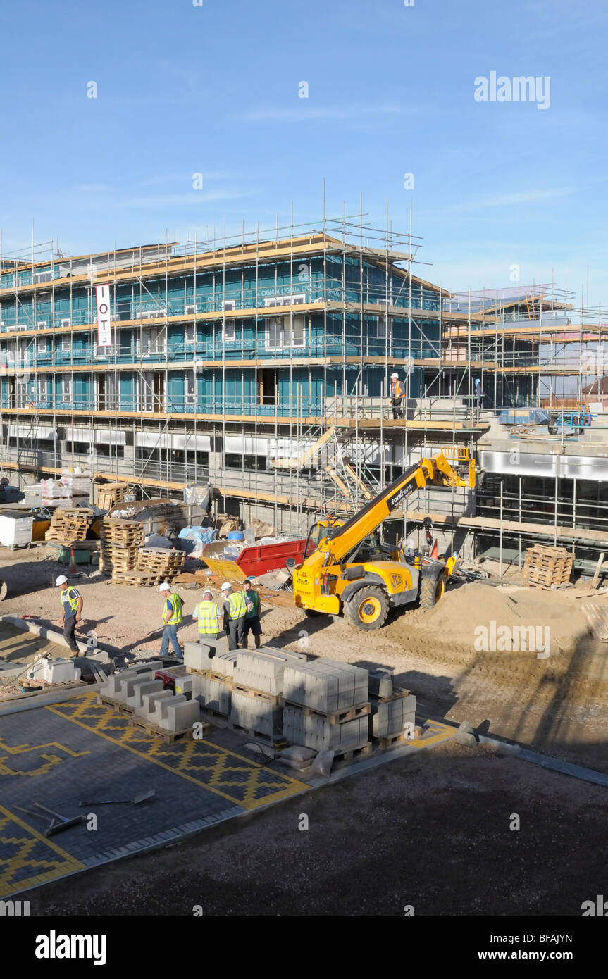 Laying block paving on building site for new Lidl supermarket Croydon ...
