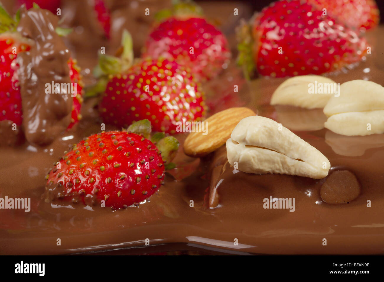 Ripe strawberry in dairy chocolate on a black background Stock Photo ...