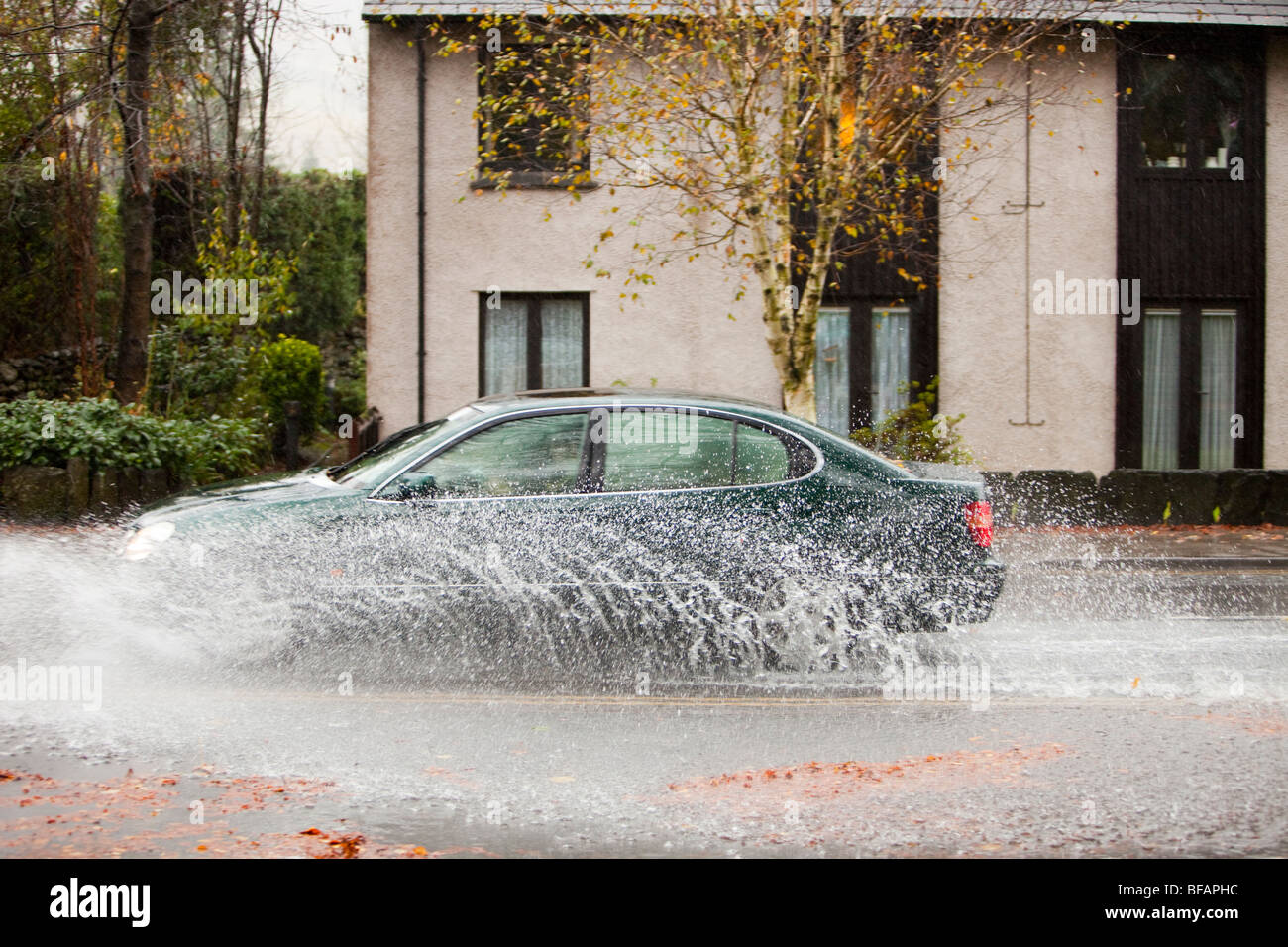 Car driving through puddle hi-res stock photography and images - Alamy