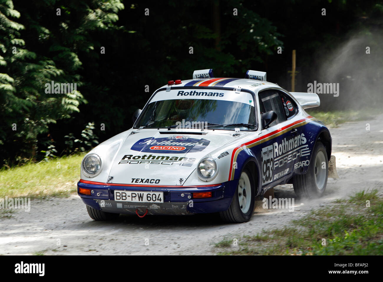 Porsche 953 Driven by Wolf-Dieter ihle over the jump on the Rally Stage ...