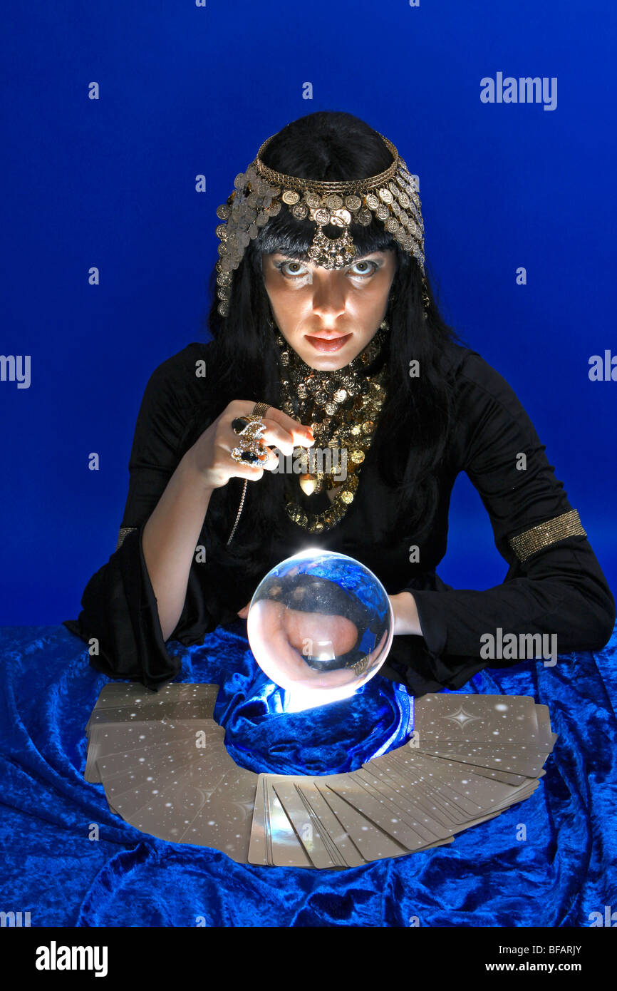 fortune teller with crystal ball, pendulum and tarot cards Stock Photo ...