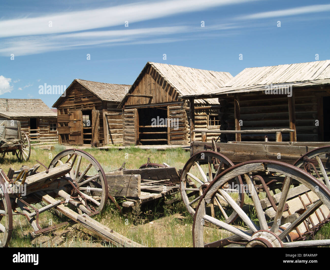 Wagons and old log buildings Old Trail town Cody Wyoming Stock Photo ...