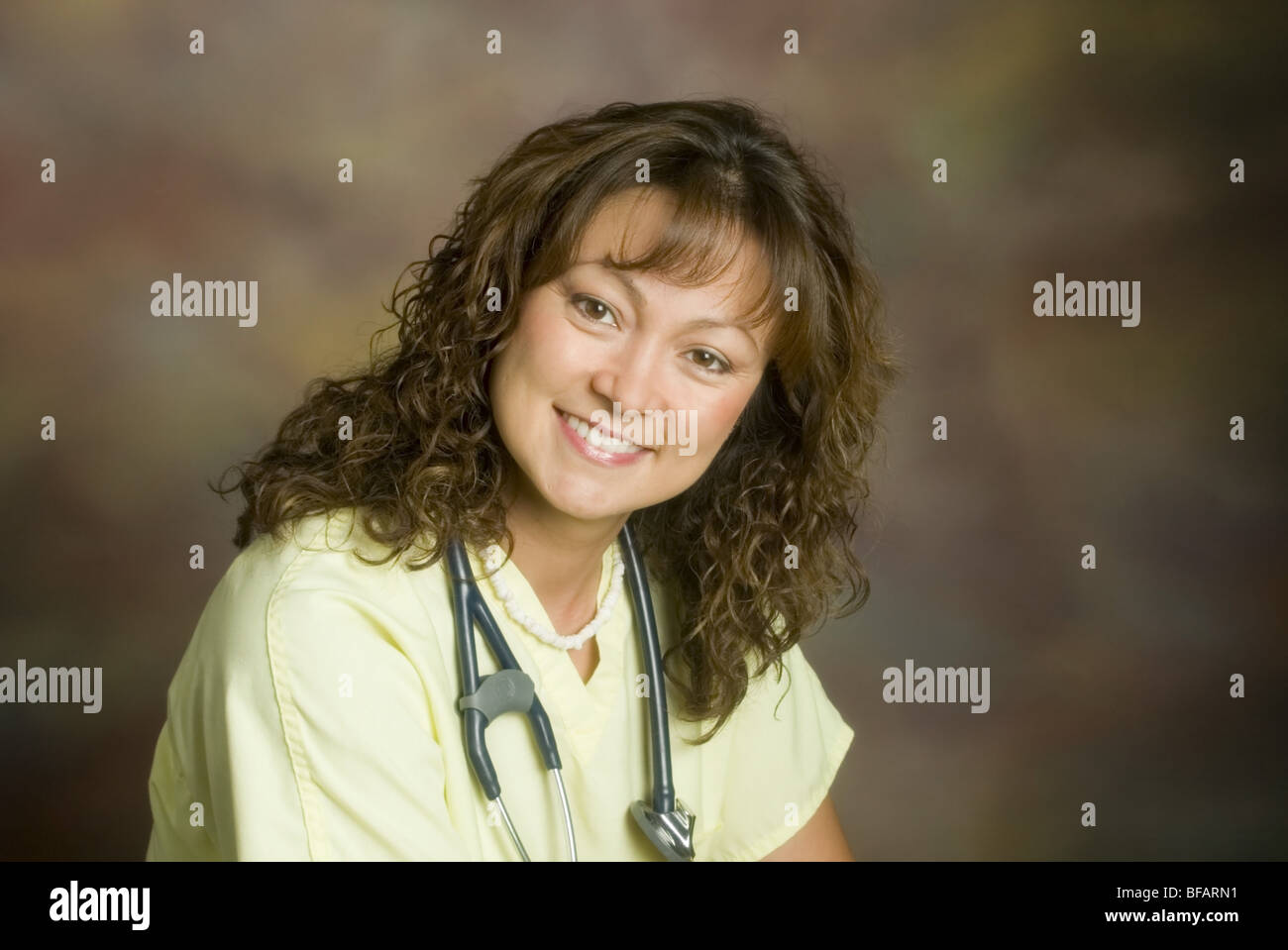 Young nurse studio background, portrait, direct to camera Stock Photo ...