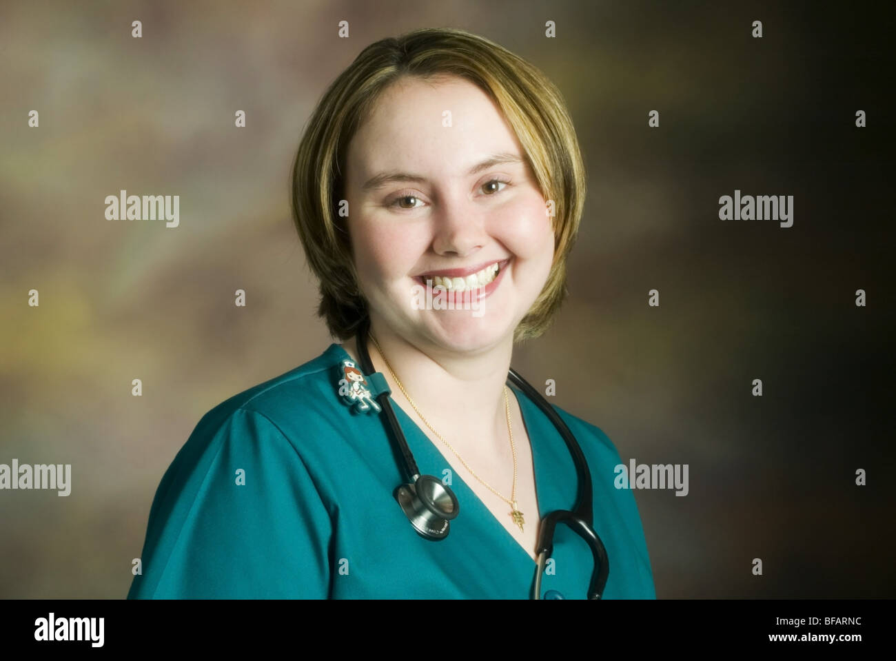 Young nurse studio background, portrait, direct to camera Stock Photo ...