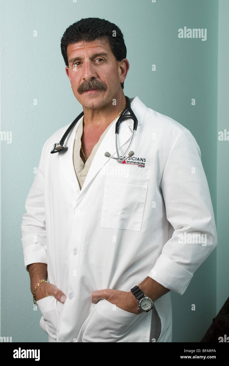 Doctor studio background, portrait, direct to camera Stock Photo - Alamy