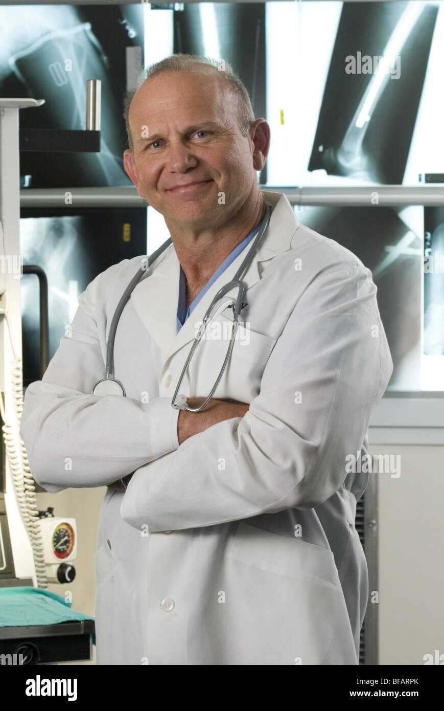 Doctor studio background, portrait, direct to camera Stock Photo - Alamy