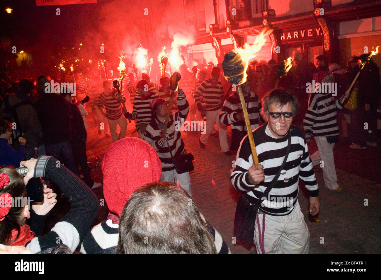 Lewes bonfire night procession. Flares, smoke and torches create ...