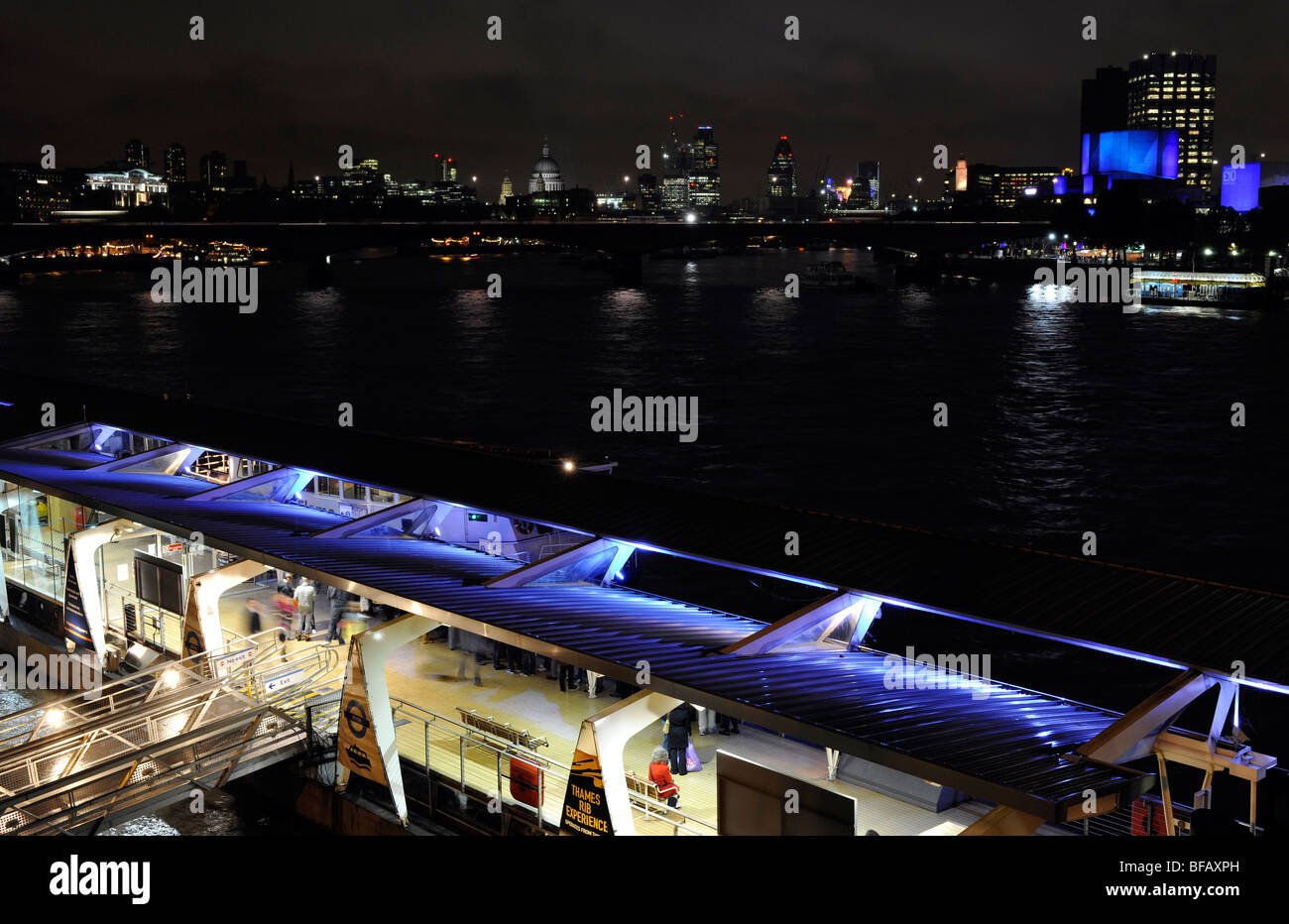 Night view of the Embankment Pier, River Thames, Central London ...