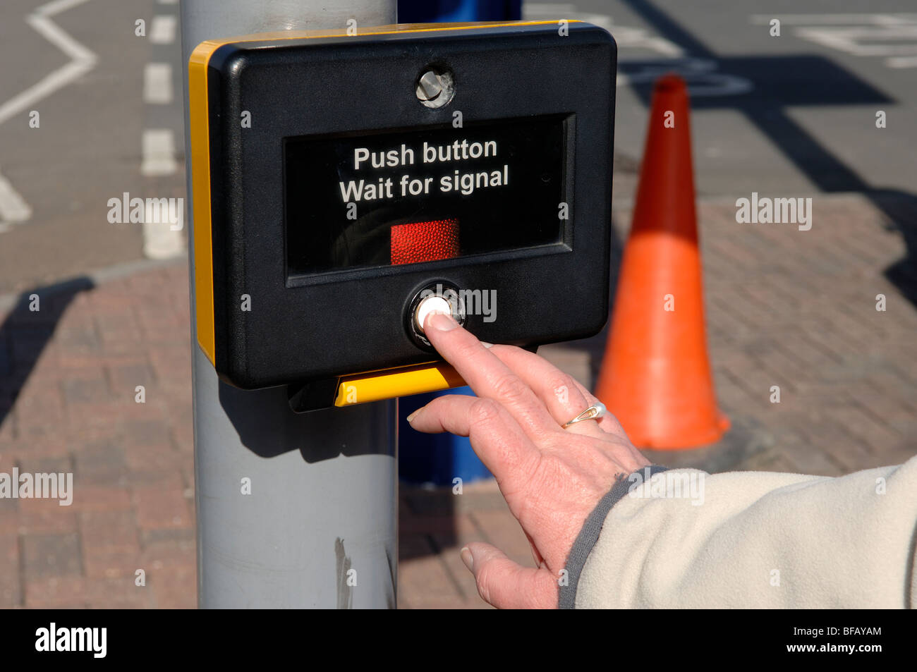 English female hand pushing button for controlled road crossing Stock ...