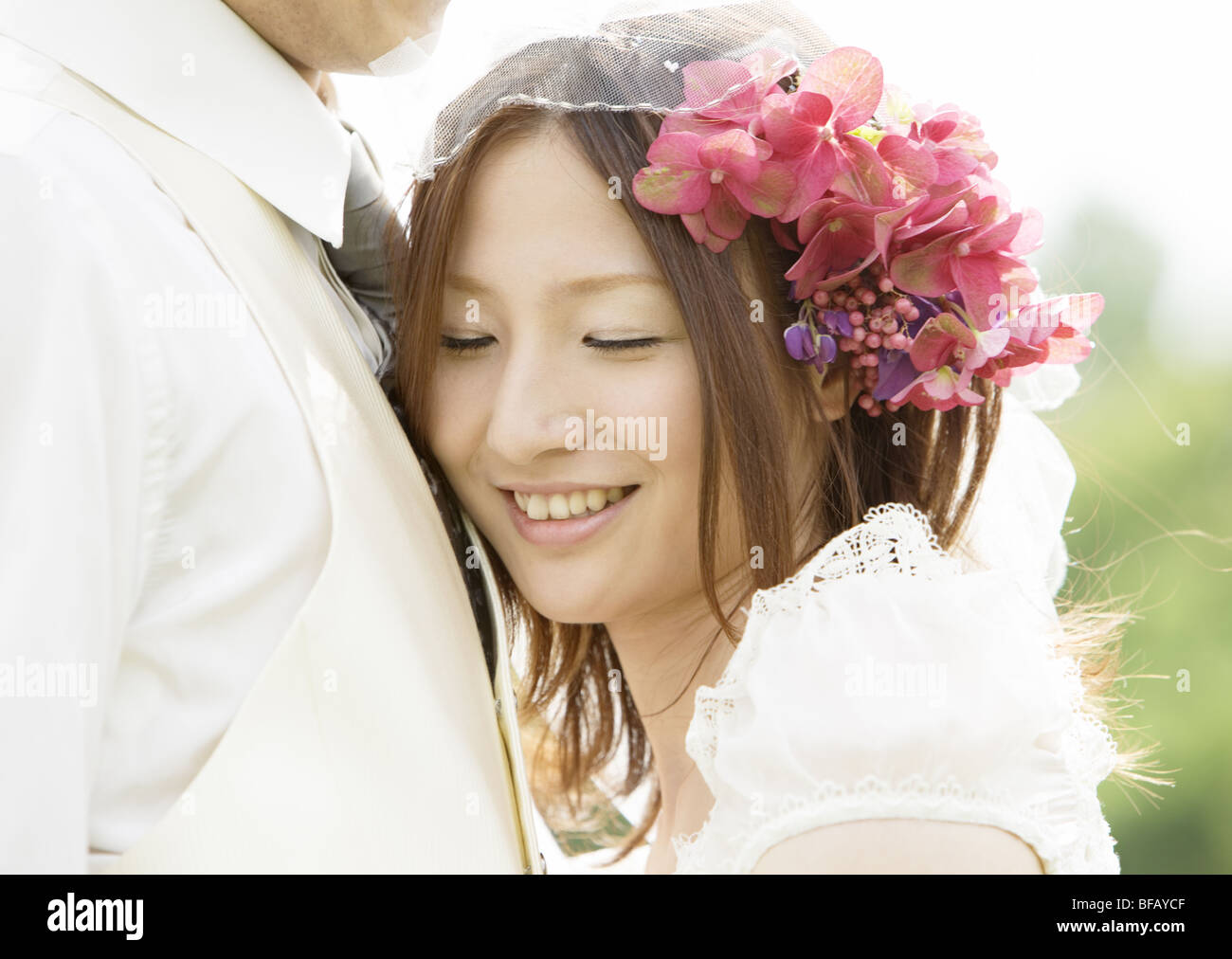 Bridal couple cuddling Stock Photo - Alamy
