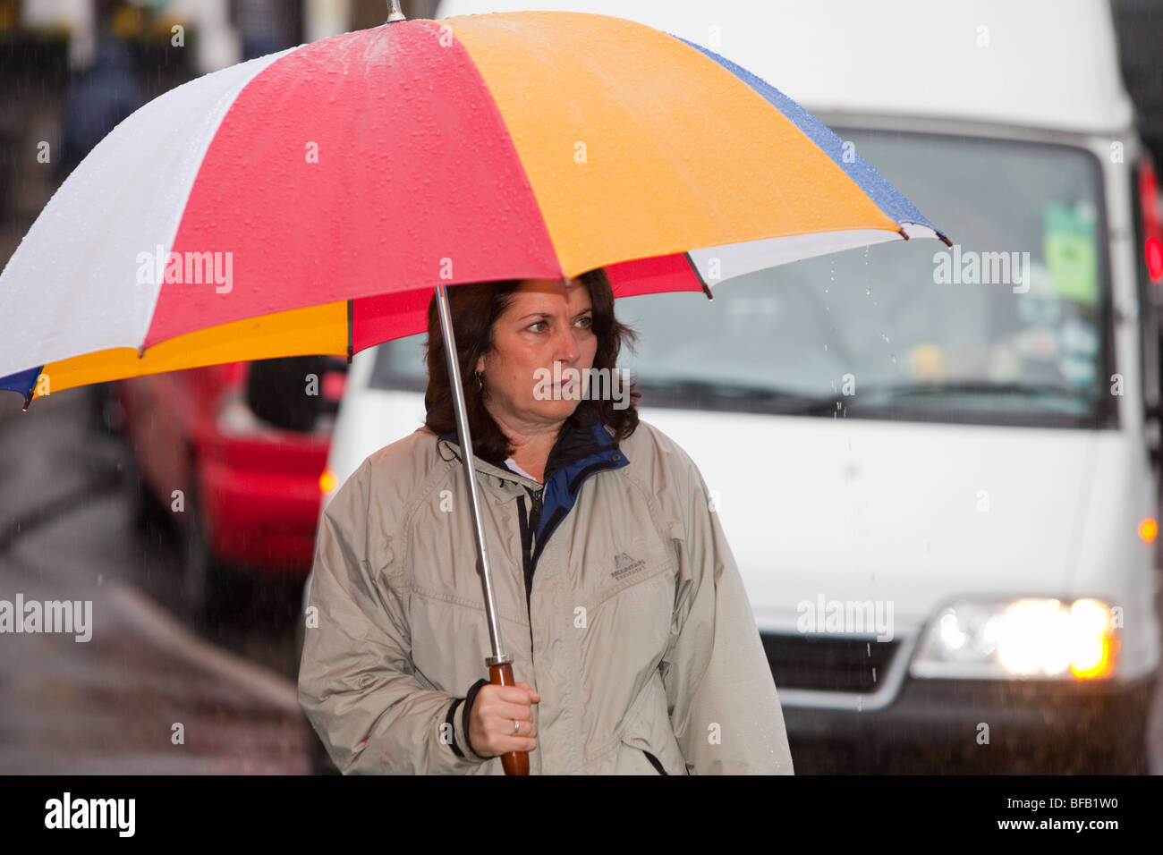 People using umbrella's in the rain in Ambleside, Cumbria, UK Stock ...