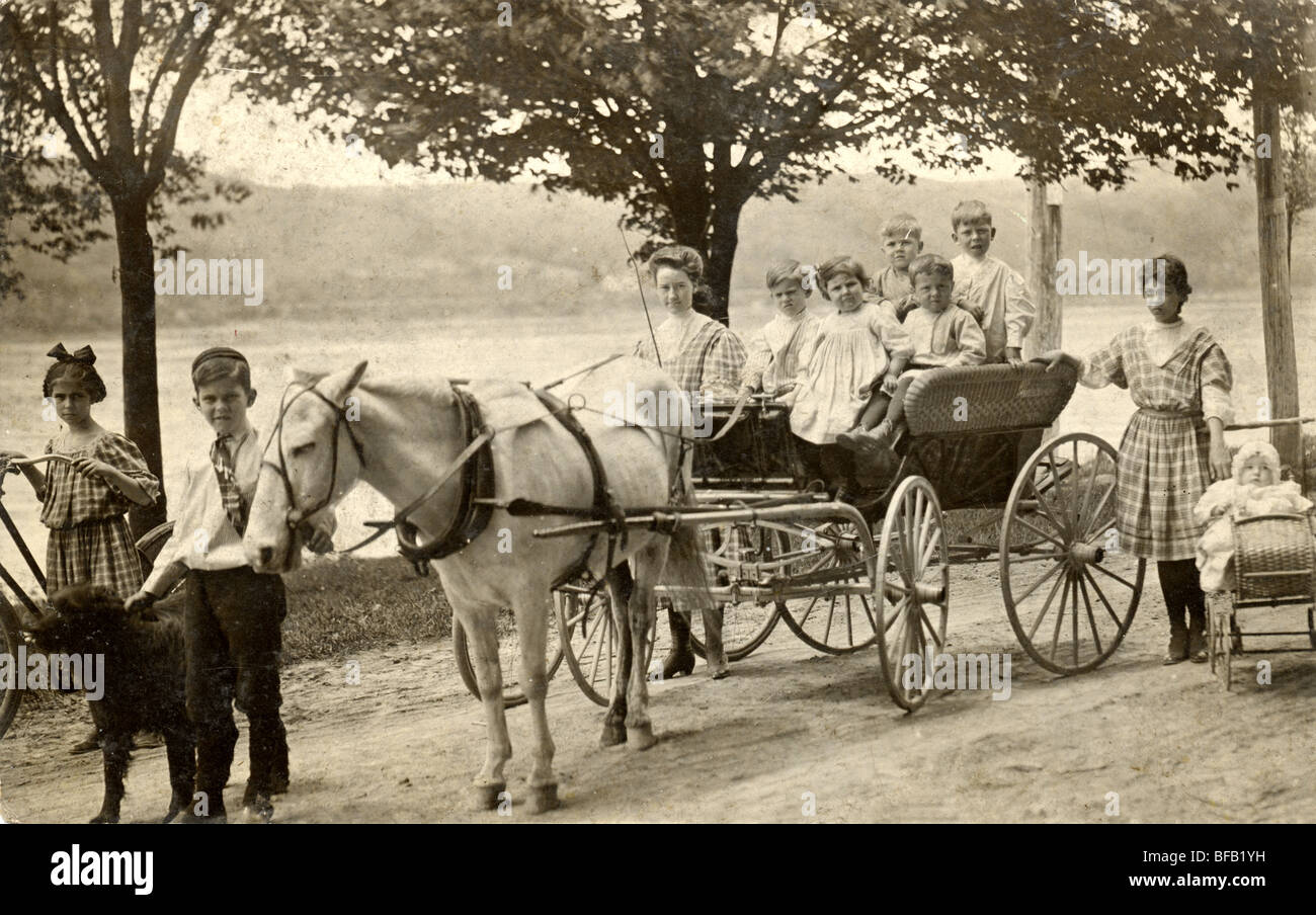 Group of Children Traveling by Horse Drawn Carriage Stock Photo - Alamy