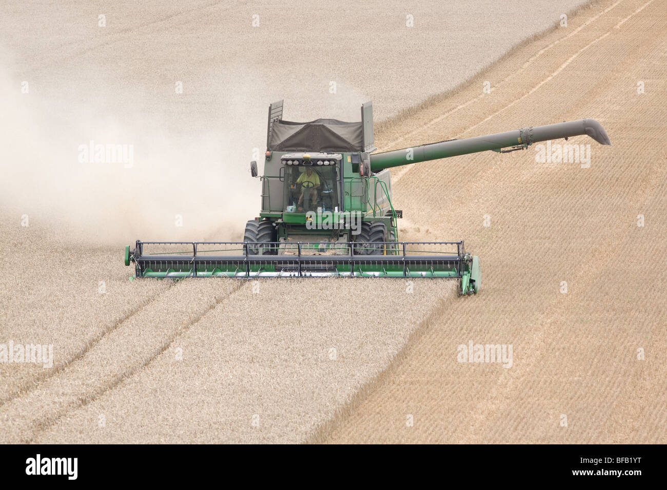 John Deere Combine Harvesting Wheat In The Lincolnshire Fens Stock ...