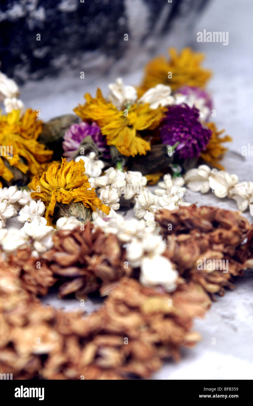 Flower offering by a buddhist statue, Bangkok, Thailand Stock Photo - Alamy