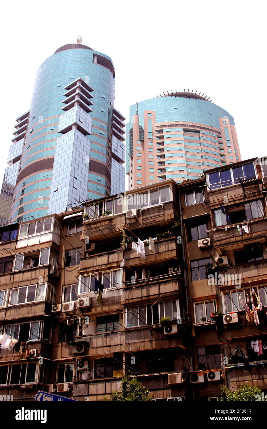 Rich and poor buildings together in Shanghai, China Stock Photo - Alamy