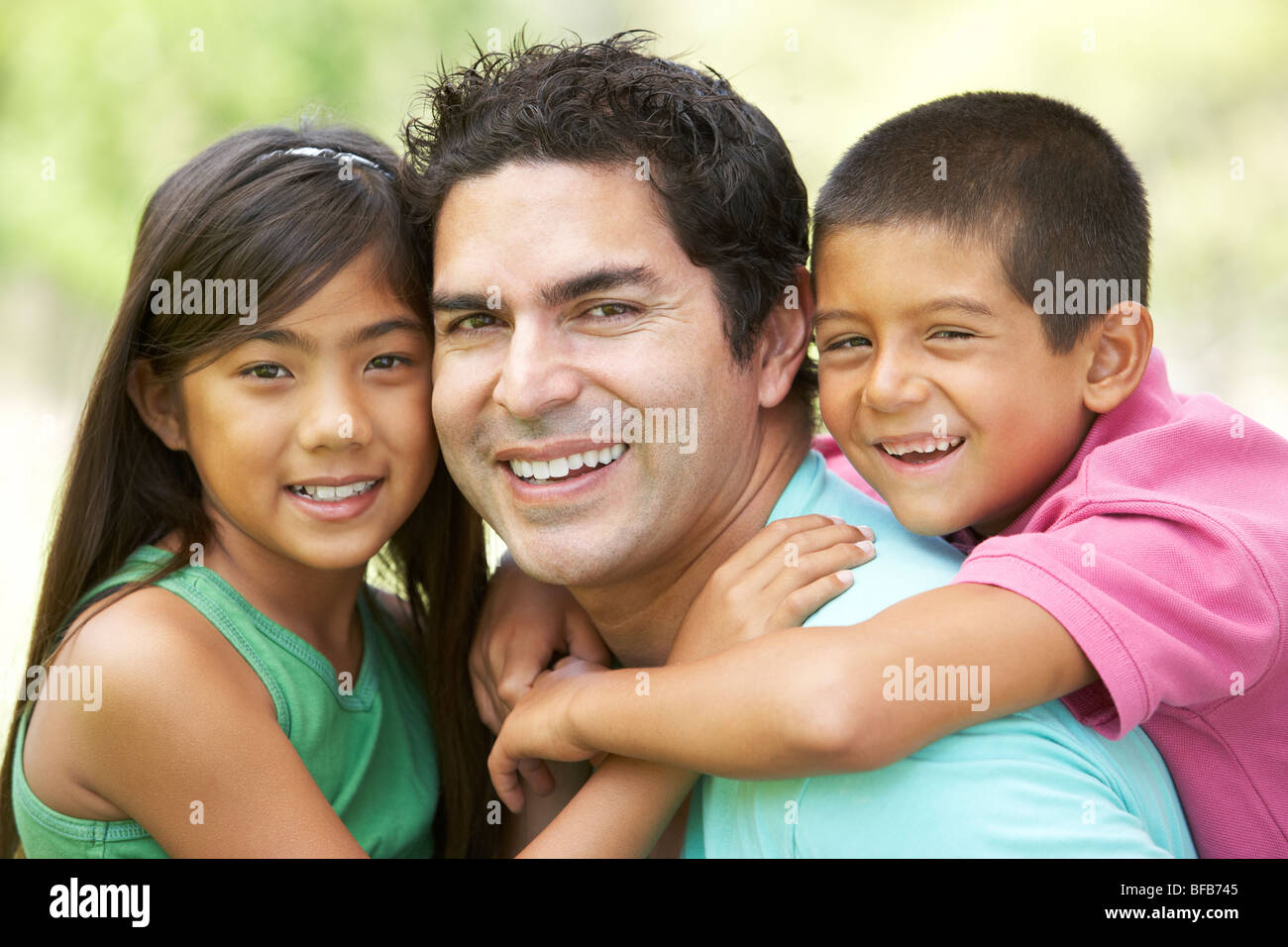 Father With Children In Park Stock Photo - Alamy