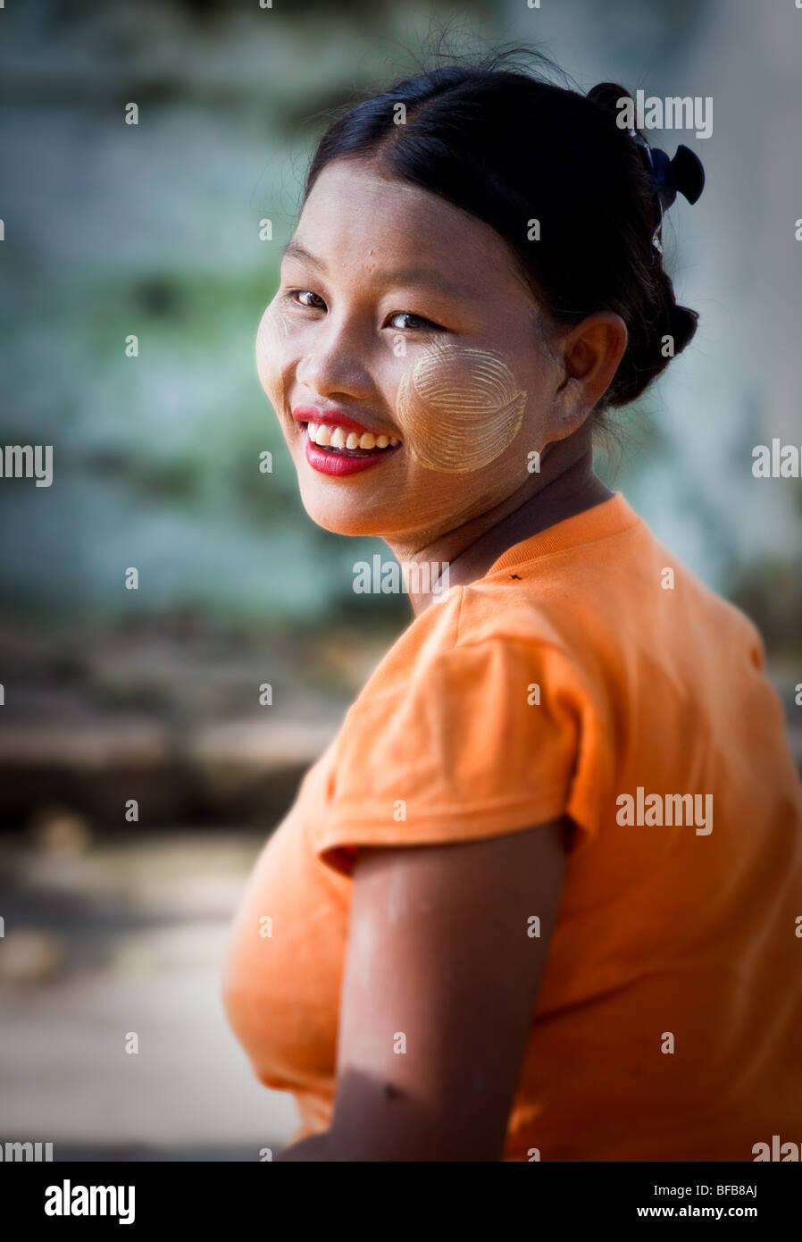 Burmese woman with Tanaka makeup in her face Stock Photo - Alamy