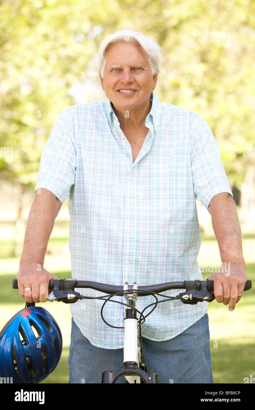 Senior Man On Cycle Ride In Park Stock Photo - Alamy