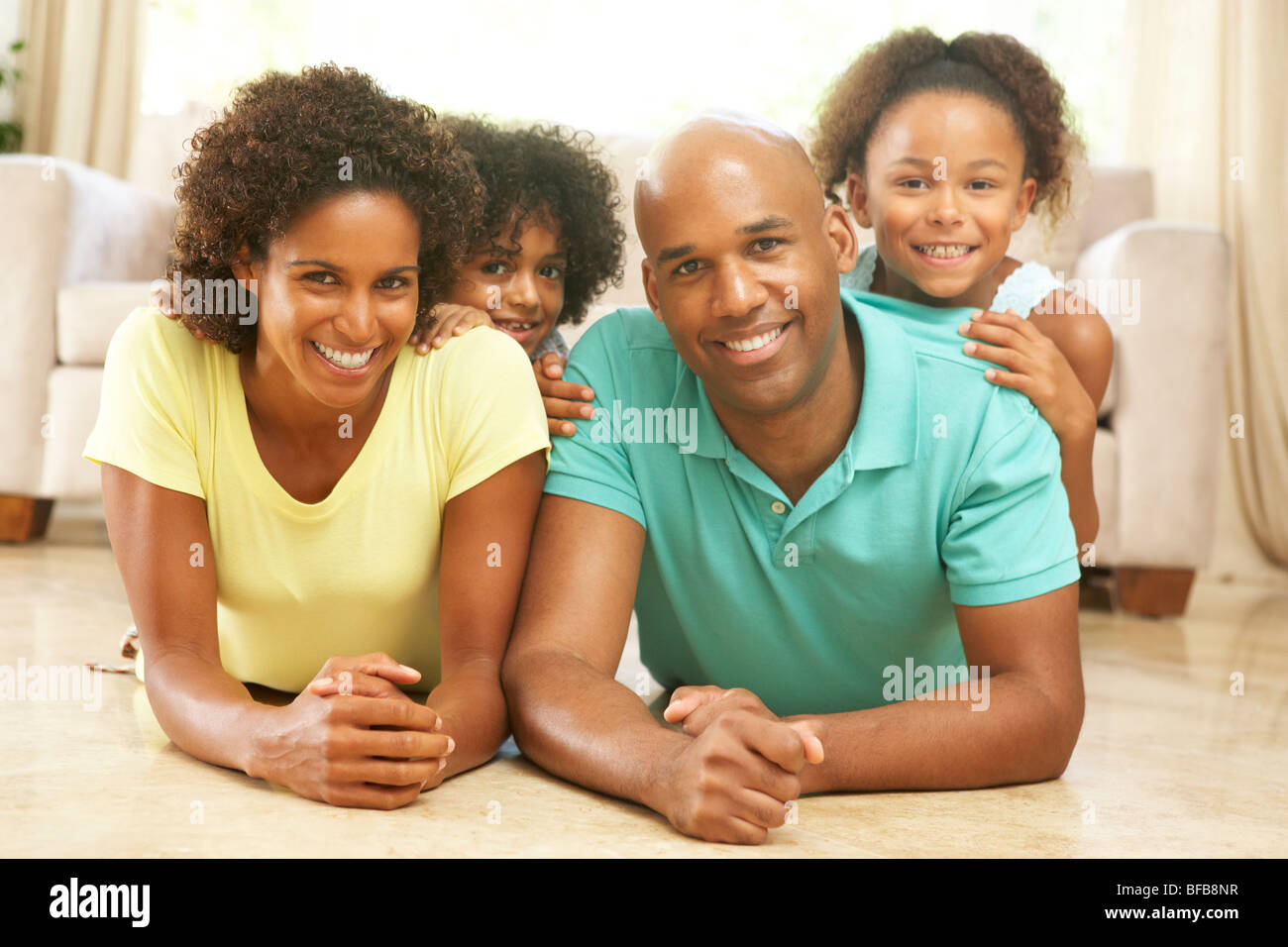 Family Relaxing At Home Together Stock Photo - Alamy