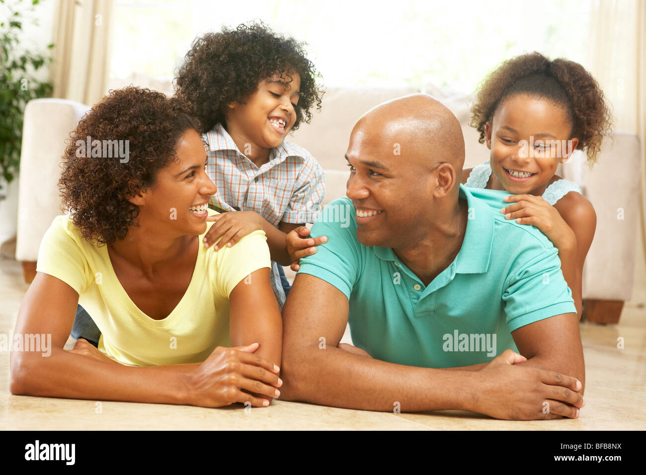 Family Relaxing At Home Together Stock Photo - Alamy