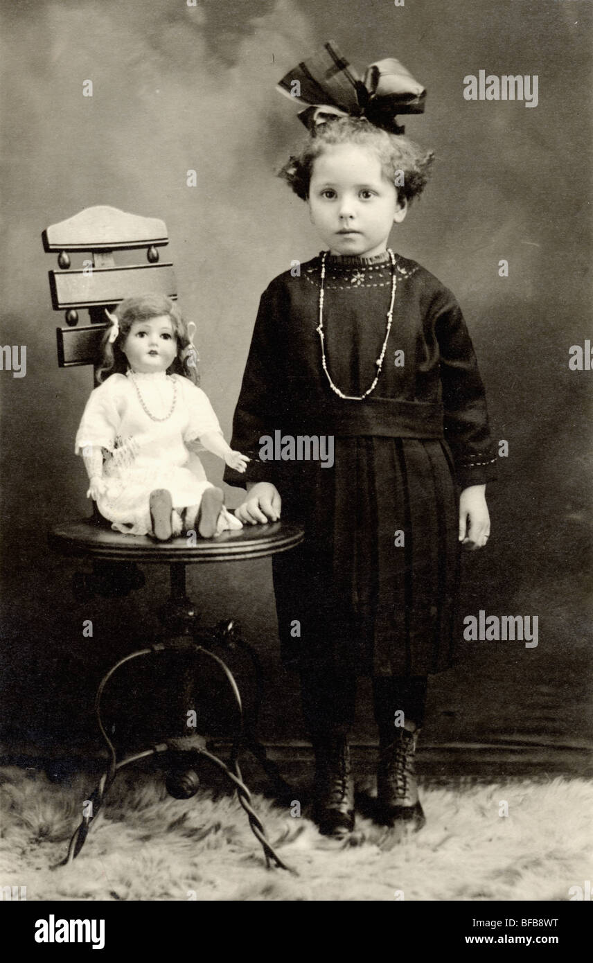 Sweet Little Girl Displaying Prized Doll Stock Photo - Alamy