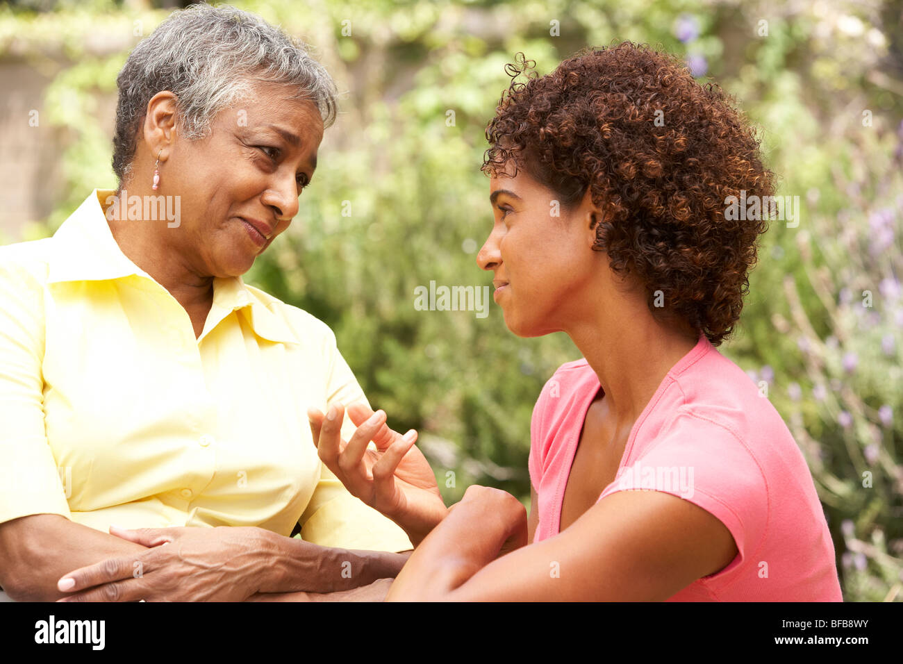 Senior Woman Being Consoled By Adult Daughter Stock Photo - Alamy