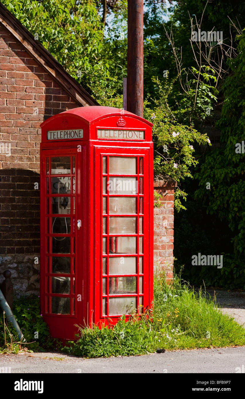 Overgrown red telephone box in hi-res stock photography and images - Alamy