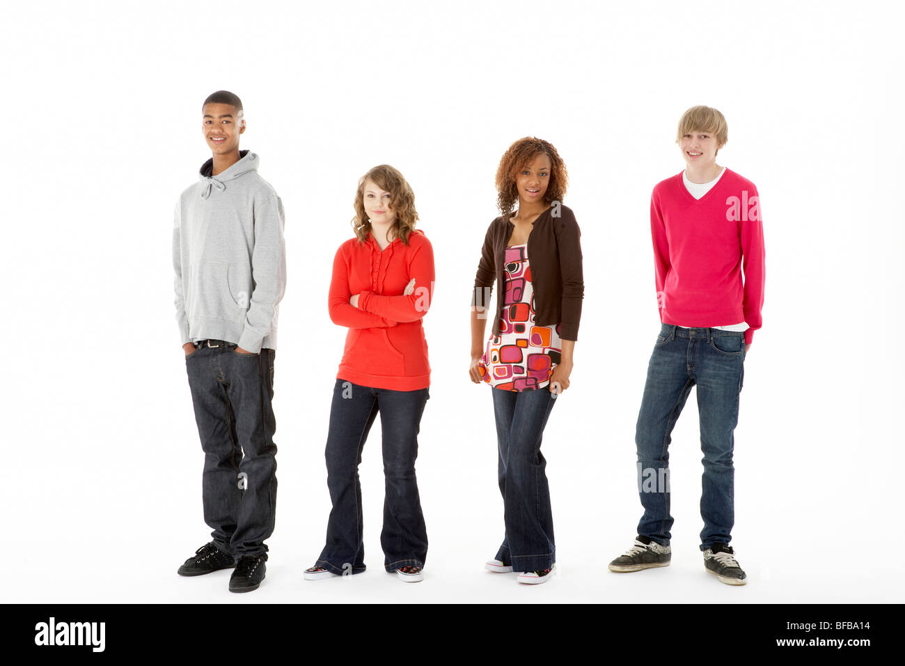 Group Of Four Teenagers In Studio Stock Photo - Alamy