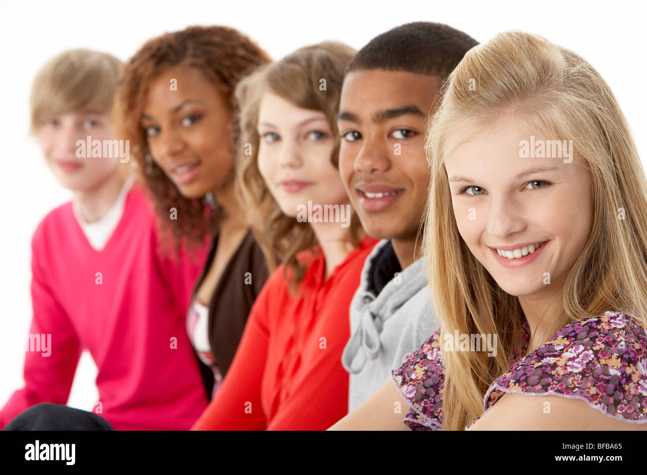Studio Portrait Of Five Teenage Friends Standing In Line Stock Photo ...